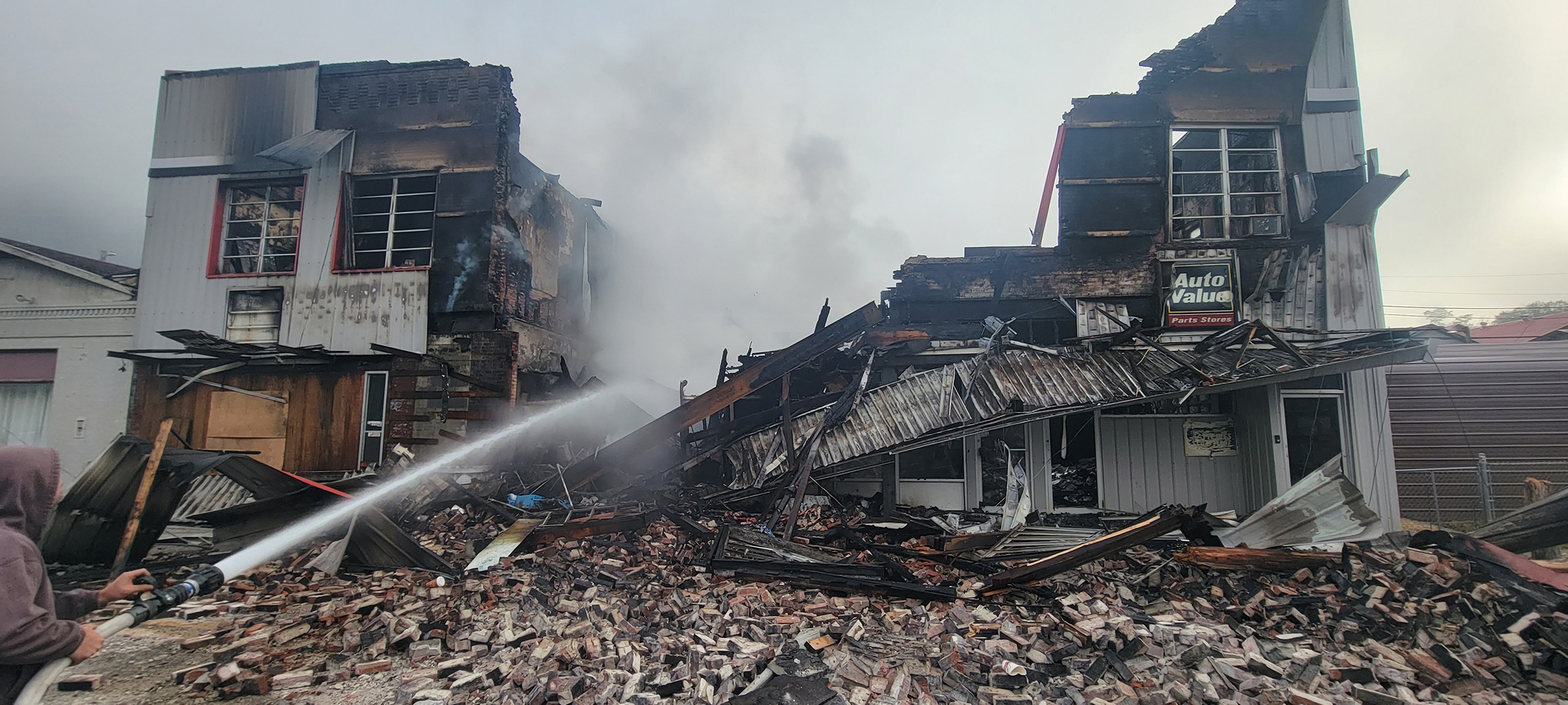 Building damaged by fire collapses in Williamson; two firefighters ...